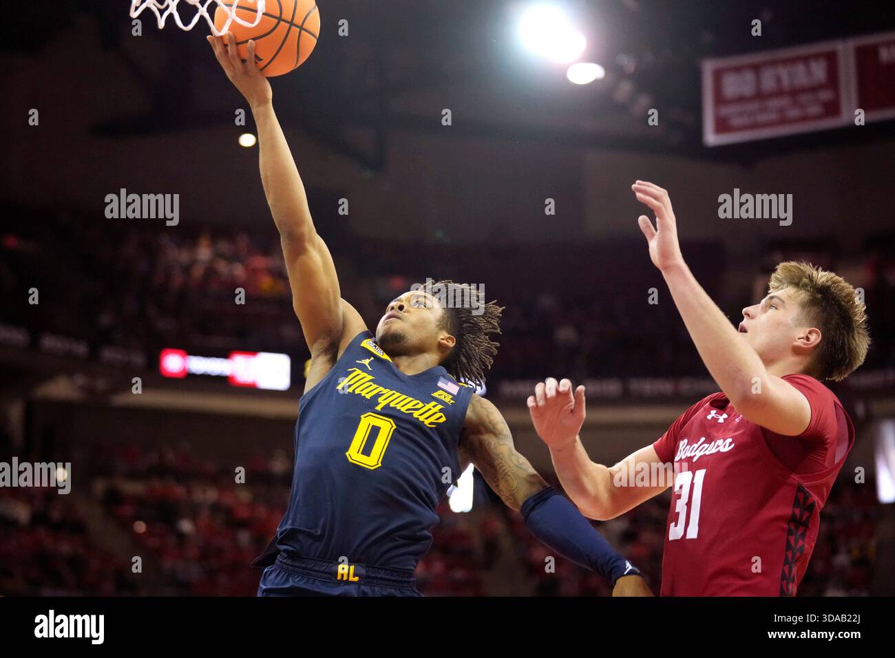 Marquette guard Nigel James Jr. (0) shoots the ball against Wisconsin ...