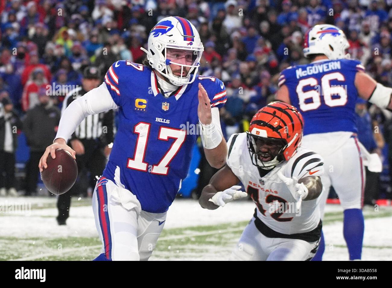 Buffalo Bills quarterback Josh Allen (17) gets past Cincinnati Bengals ...