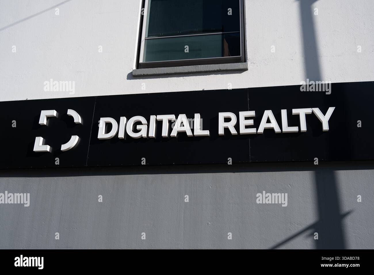 Digital Realty data center exterior with company logo on black and ...