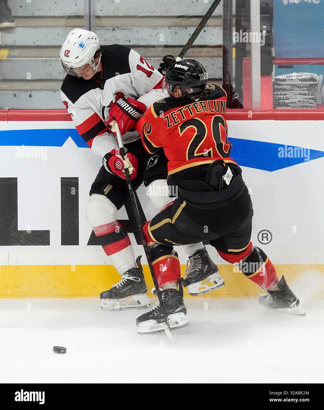 Ottawa Senators left wing Fabian Zetterlund (20) checks New Jersey ...