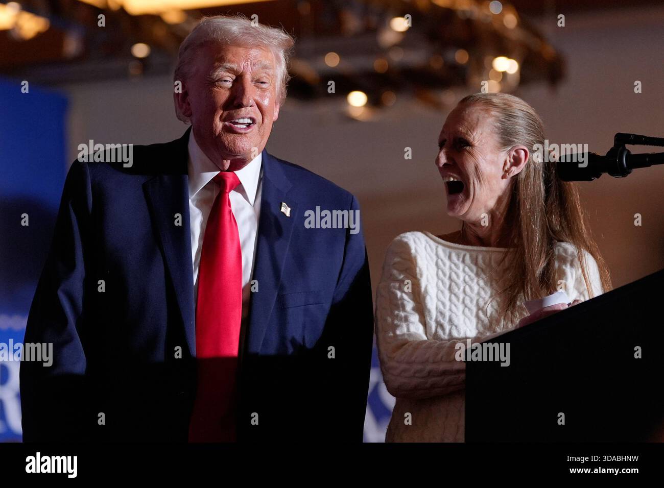 President Donald Trump smiles as Donna Zajack speaks at Mount Airy ...