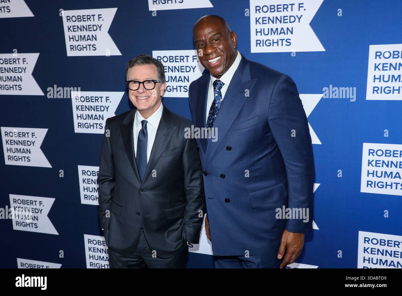 Stephen Colbert, left, and Magic Johnson attend the annual Robert F ...