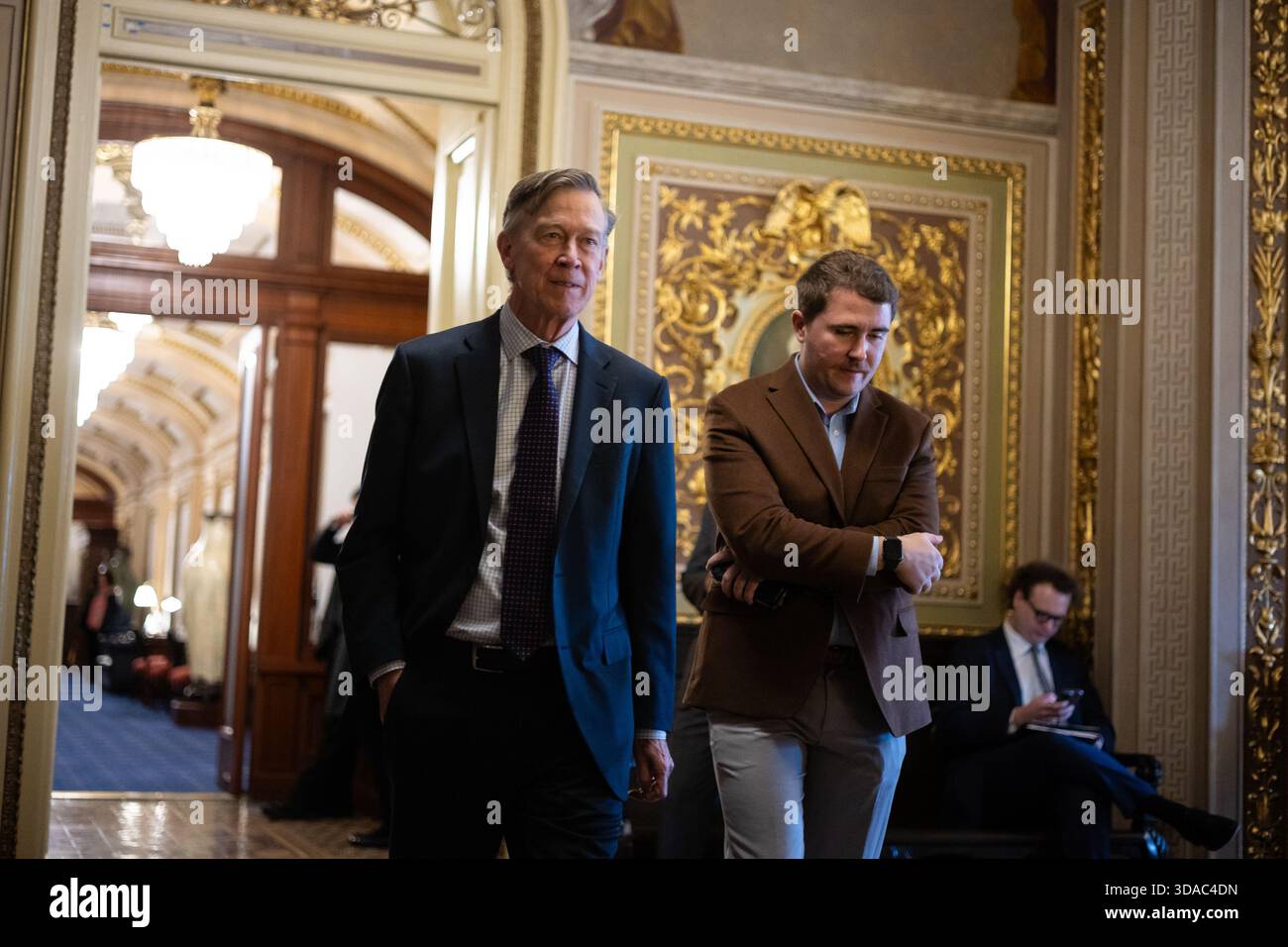 Sen. John Hickenlooper (D-Colo.) arrives for a Senate Democratic Caucus ...