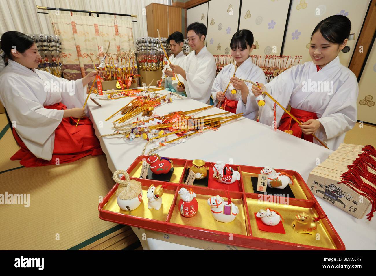 Shrine maidens and priests are busy making Shinto ornaments to welcome ...