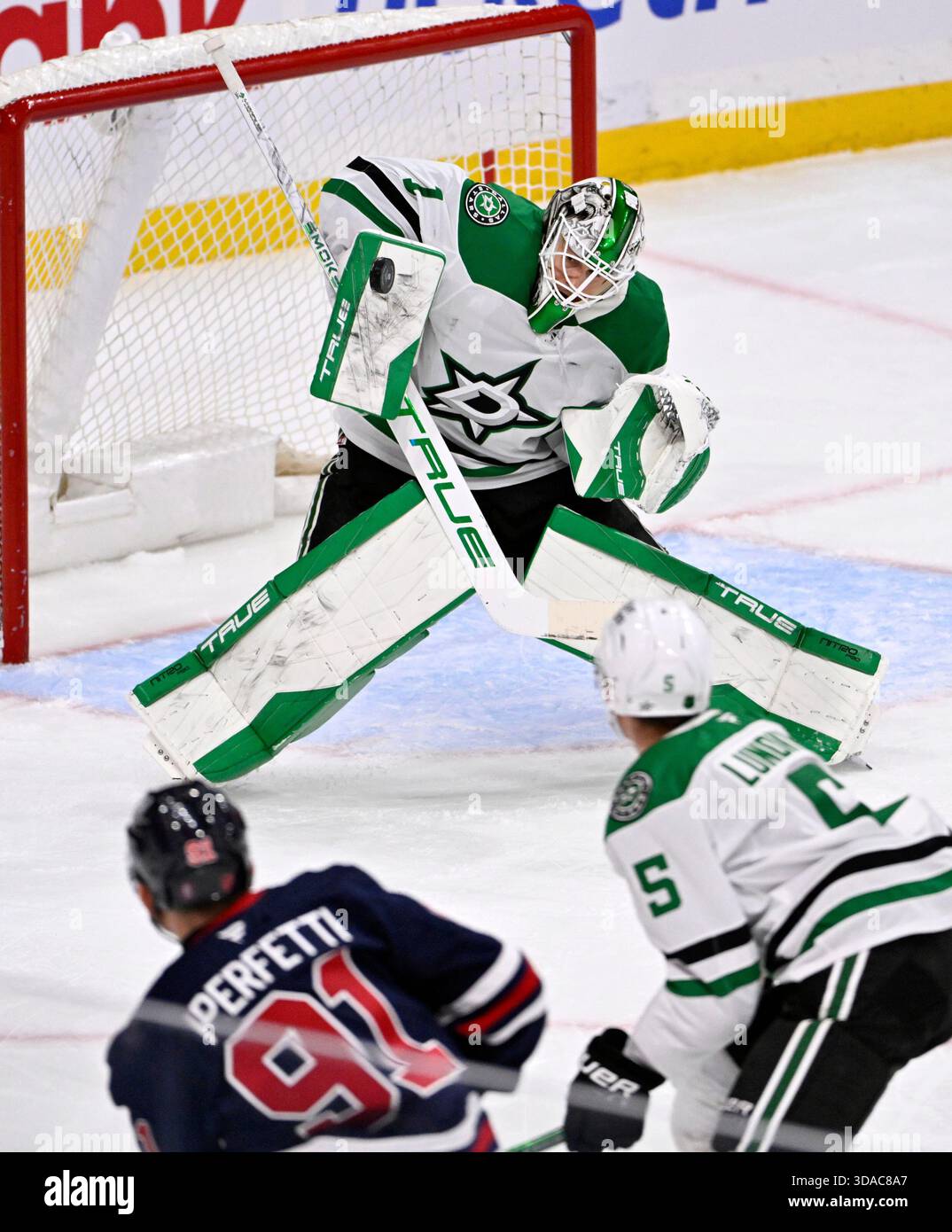 Dallas Stars' goaltender Casey DeSmith (1) makes a save on Winnipeg ...
