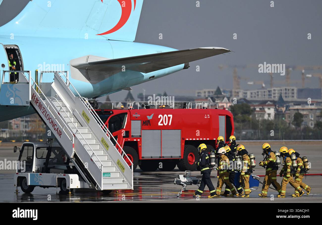 The rescue personnel entered the aircraft rescue drill scene carrying a ...