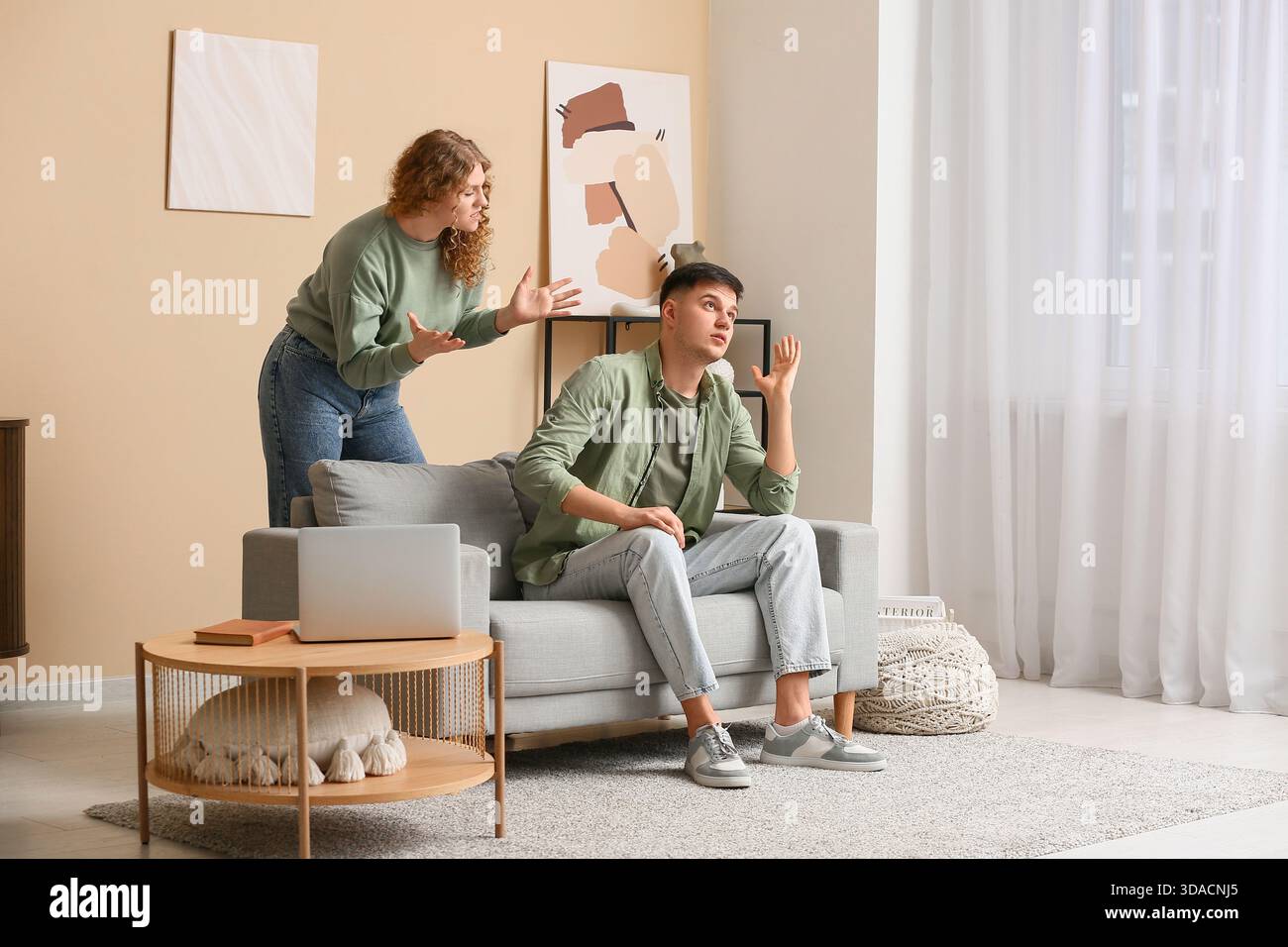 Angry wife scolding her husband at home Stock Photo - Alamy