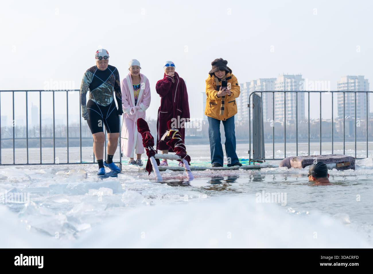 Winter swimming enthusiasts swim in the icy water in Daqing City ...