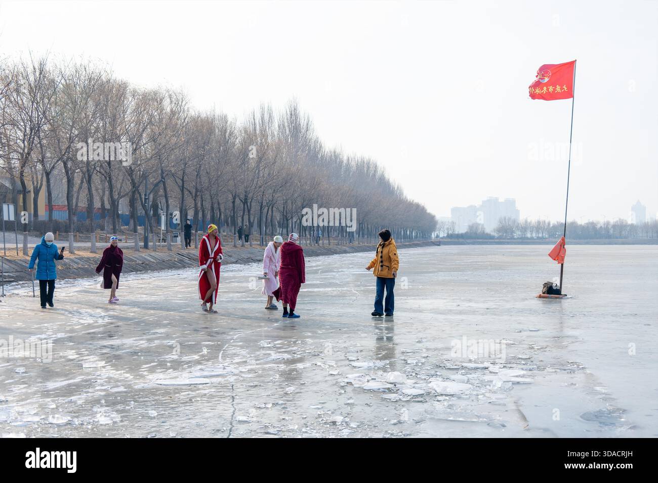 Winter swimming enthusiasts swim in the icy water in Daqing City ...