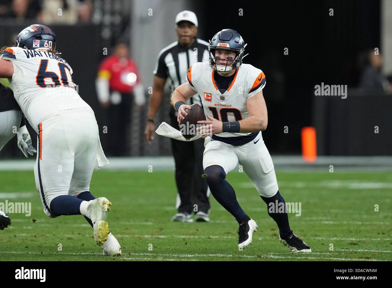 Denver Broncos quarterback Bo Nix (10) runs the ball during the first ...