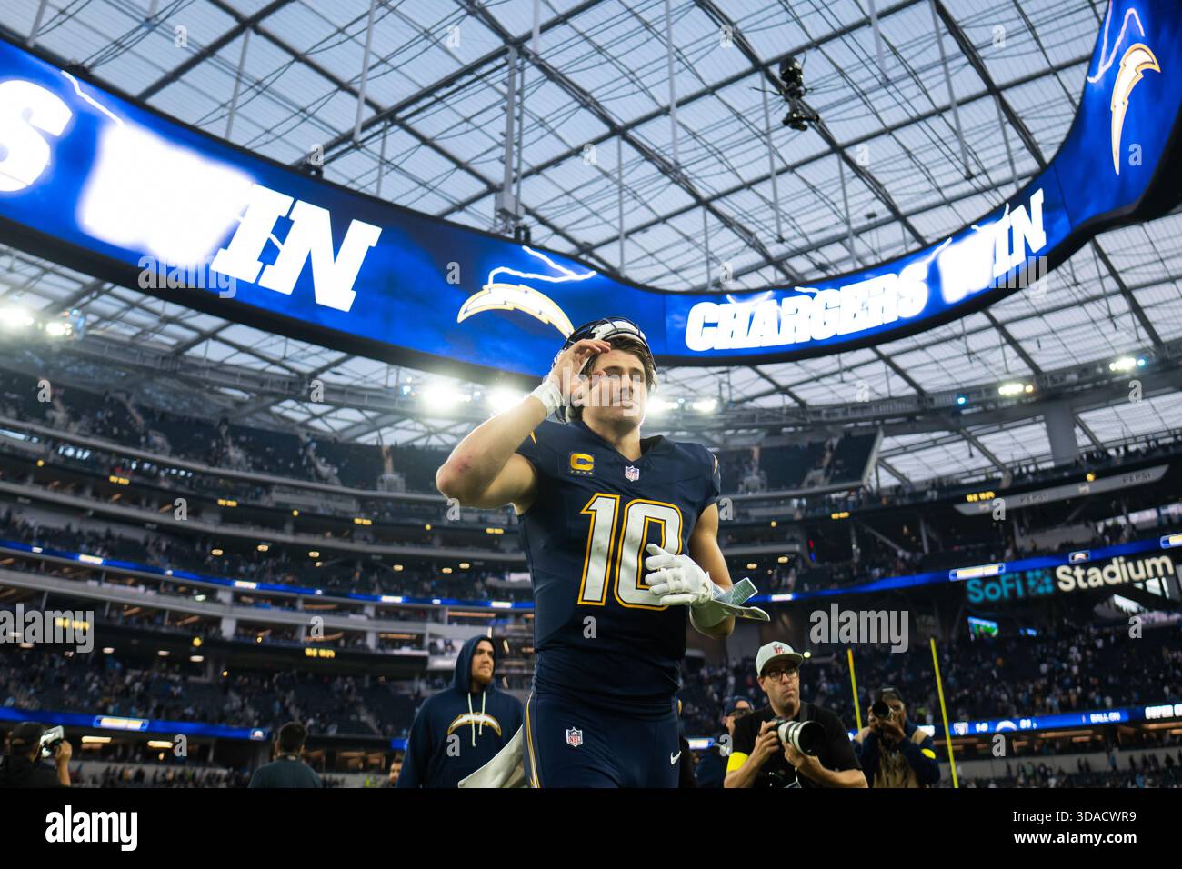 Los Angeles Chargers quarterback Justin Herbert (10) jogs back to the ...
