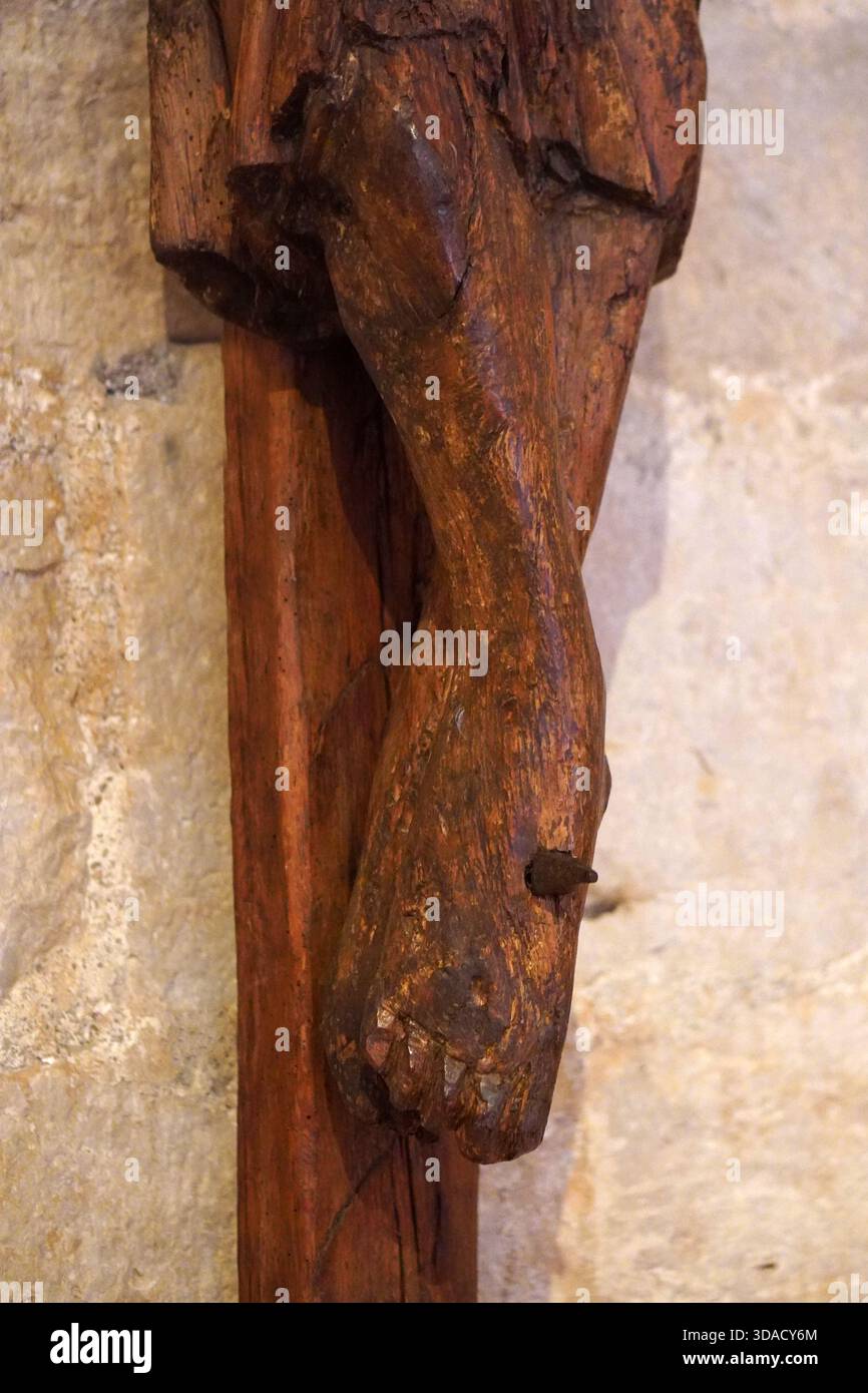 Feet of Jesus Christ nailed to the cross, in an antique wooden ...