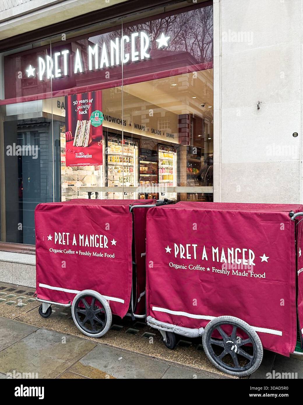 Delivery carts are parked in front of a Pret A Manger store in central ...