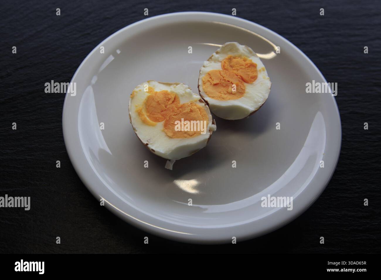 This rare chicken egg has been cracked open to reveal two perfectly ...