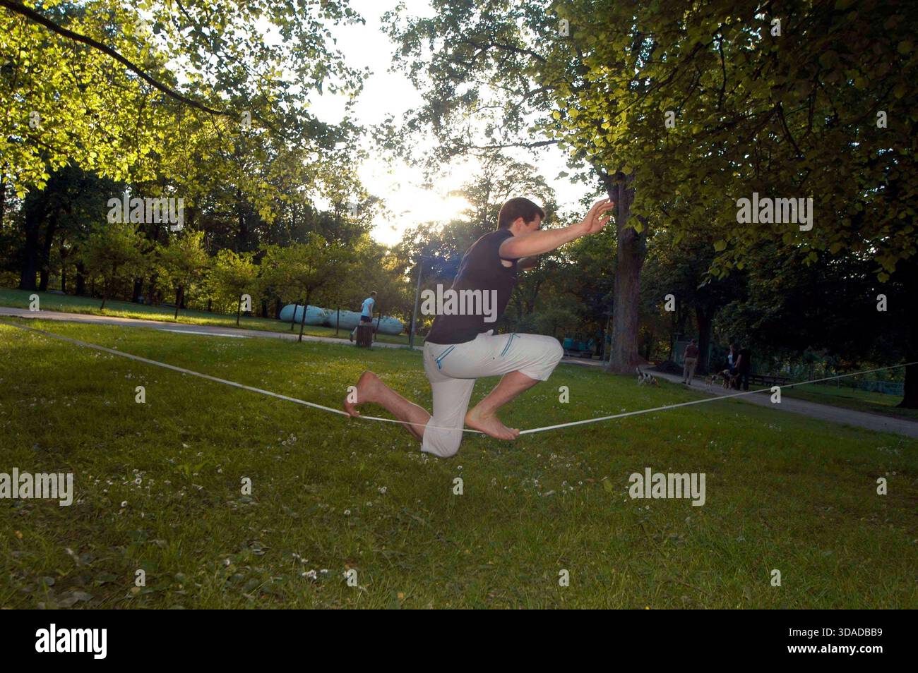 slacklining or walking on a tightrope, balancing on a rope slacklining ...