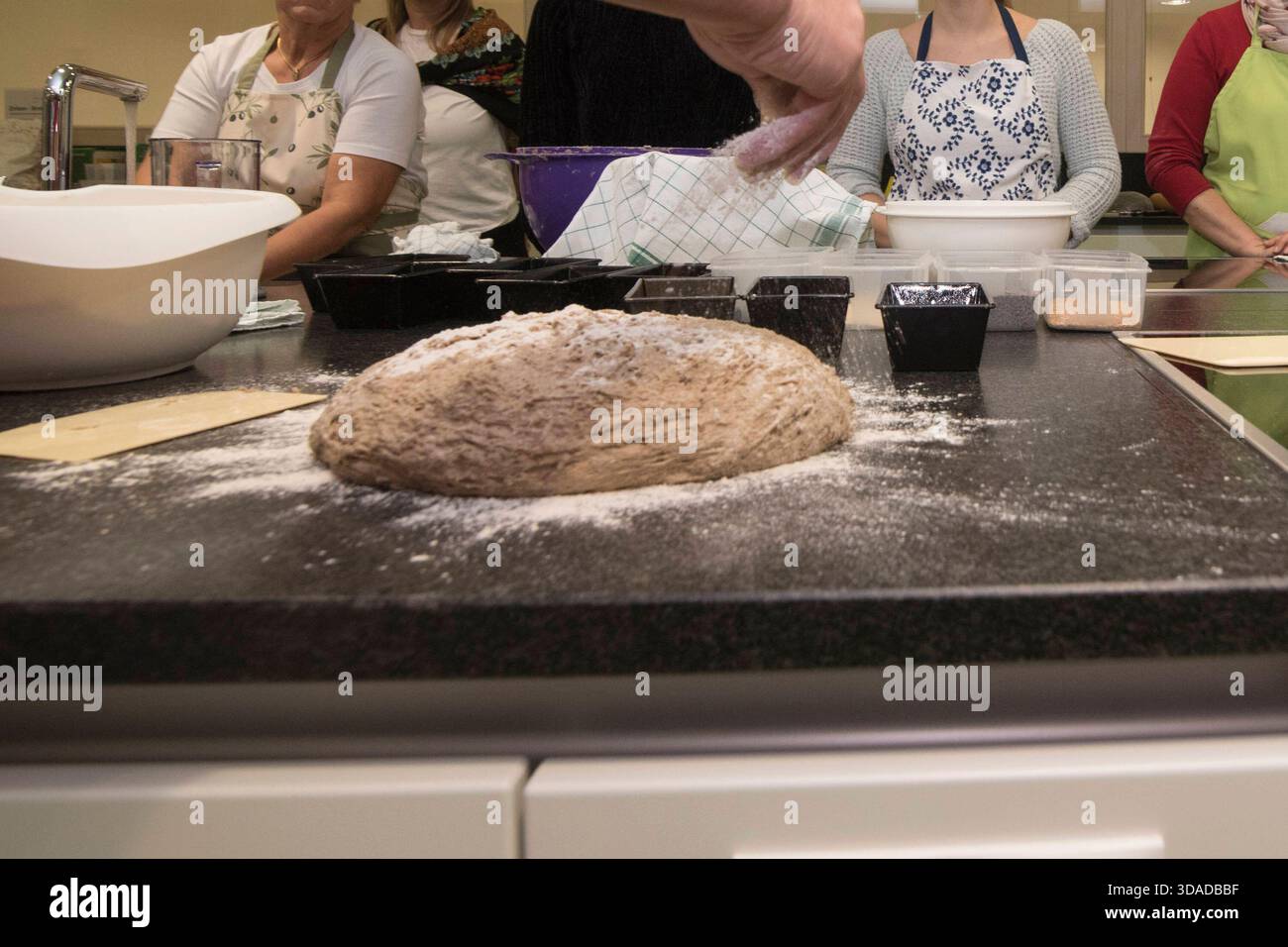 baking bread in the kitchen, with homemade bread dough baking bread in ...