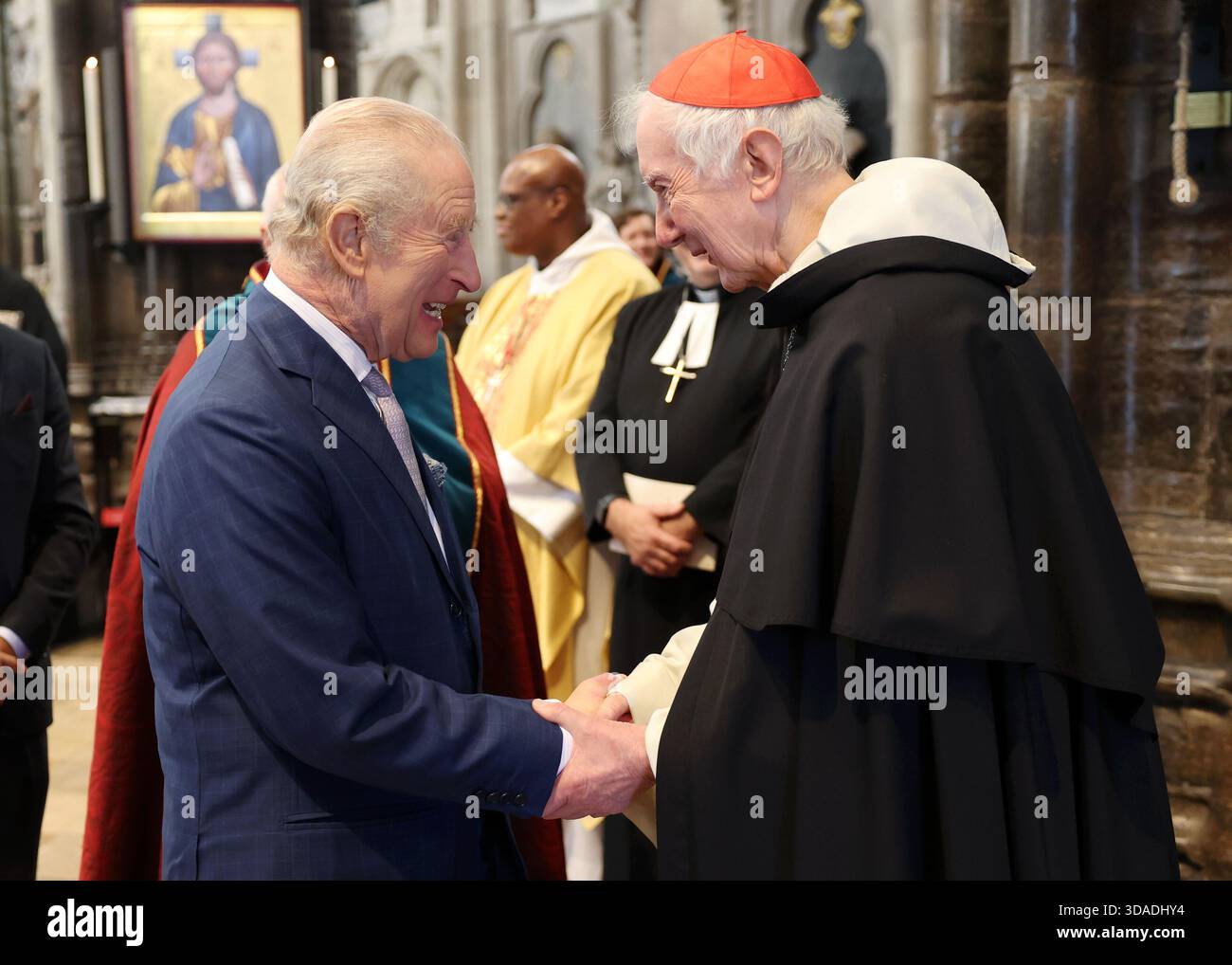 Britain's King Charles III speaks with Cardinal Timothy Radcliffe as he attends an Advent ...