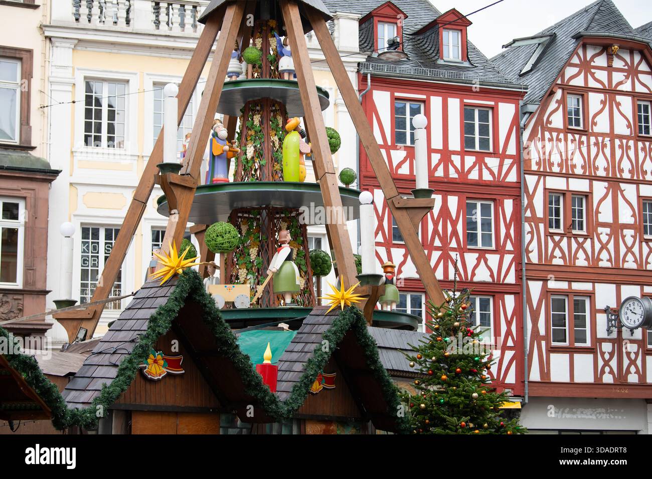Christmas market in Trier, Germany, wood carving pyramid, fir tree with ...