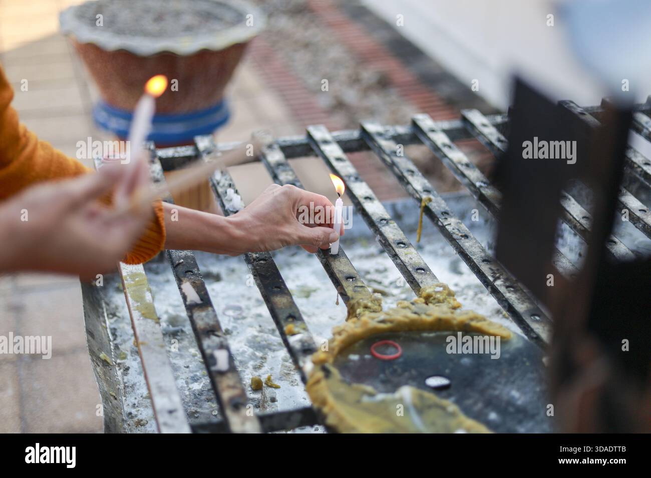 Monk hand lighting prayer hi-res stock photography and images - Alamy