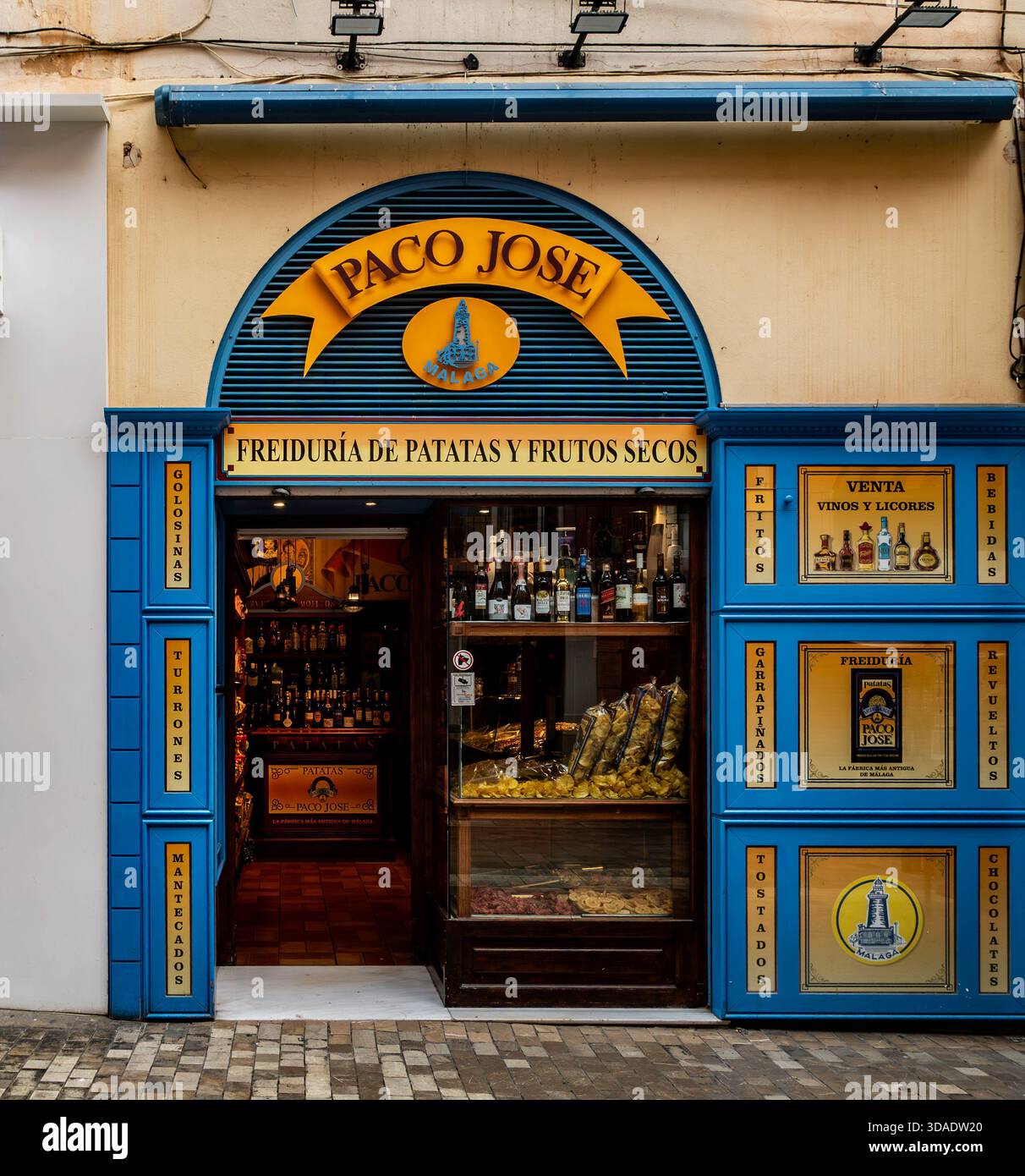 The vibrant, blue and yellow storefront of Paco Jose in Malaga, Spain ...