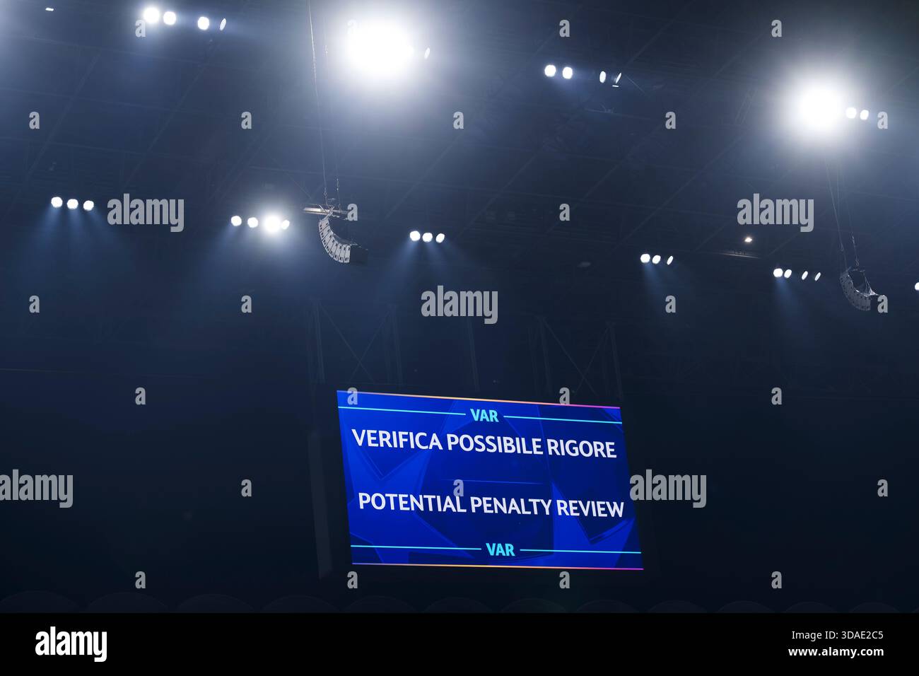 A giant screen display a write during a VAR review for a penalty kick ...