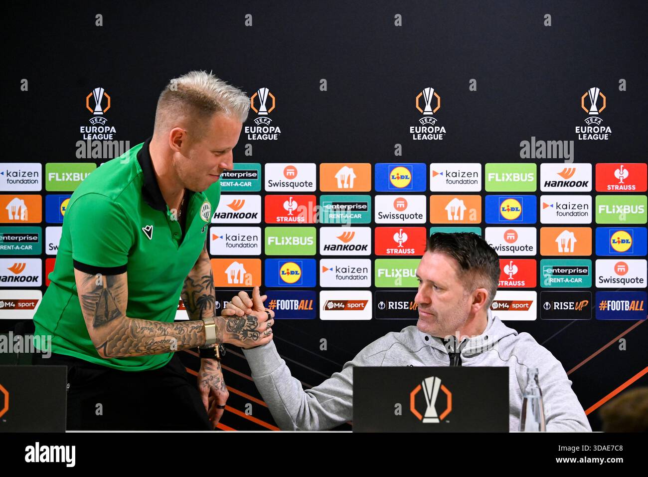 Ferencvaros' head coach Robbie Keane, right, and goalkeeper David Grof ...