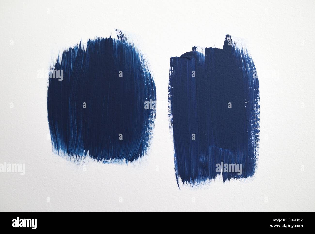 Blue paint samples white wall. Test paint patches side-by-side for ...