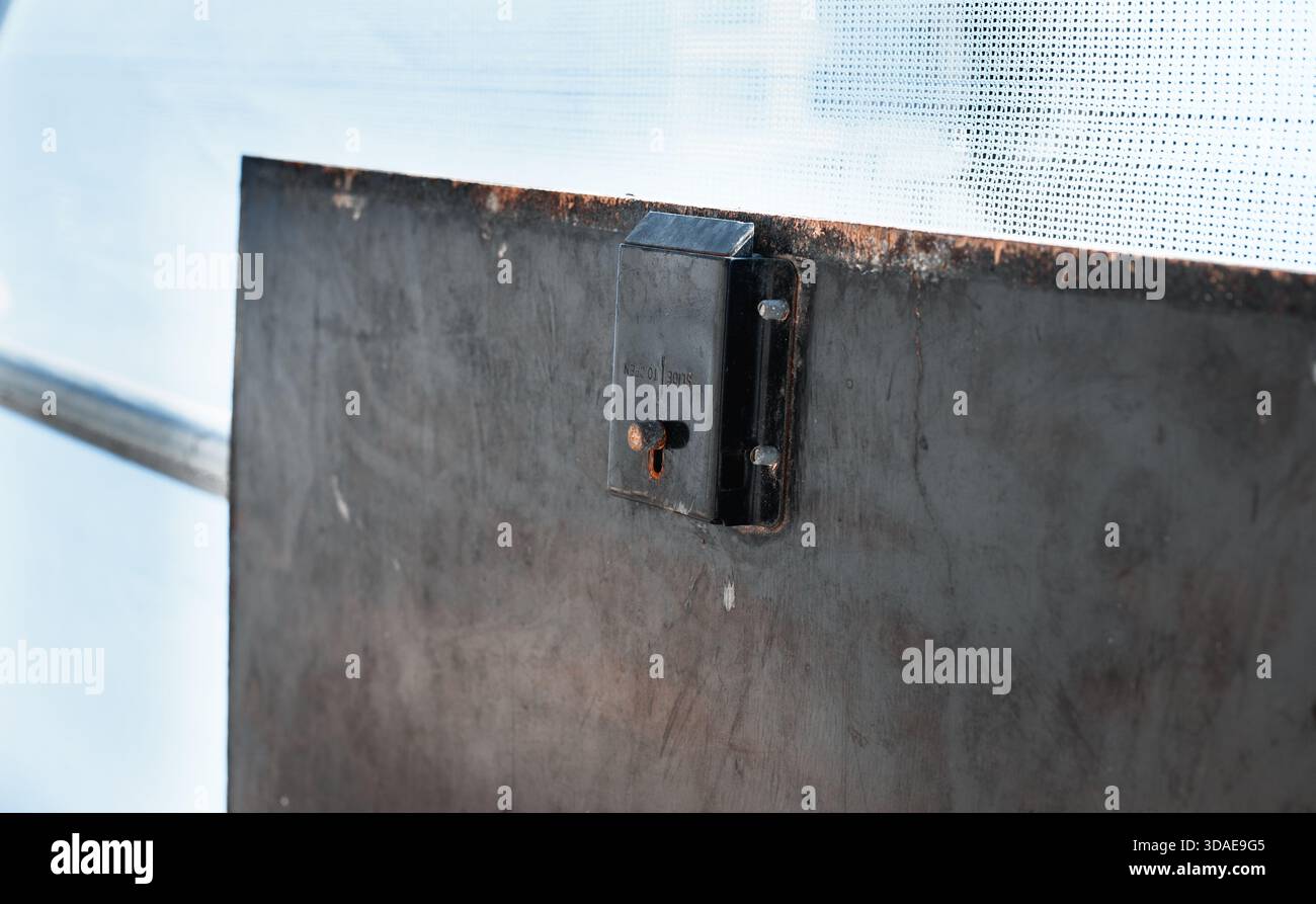 Open trapdoor locking part. Close up of open staircase hatch in ...