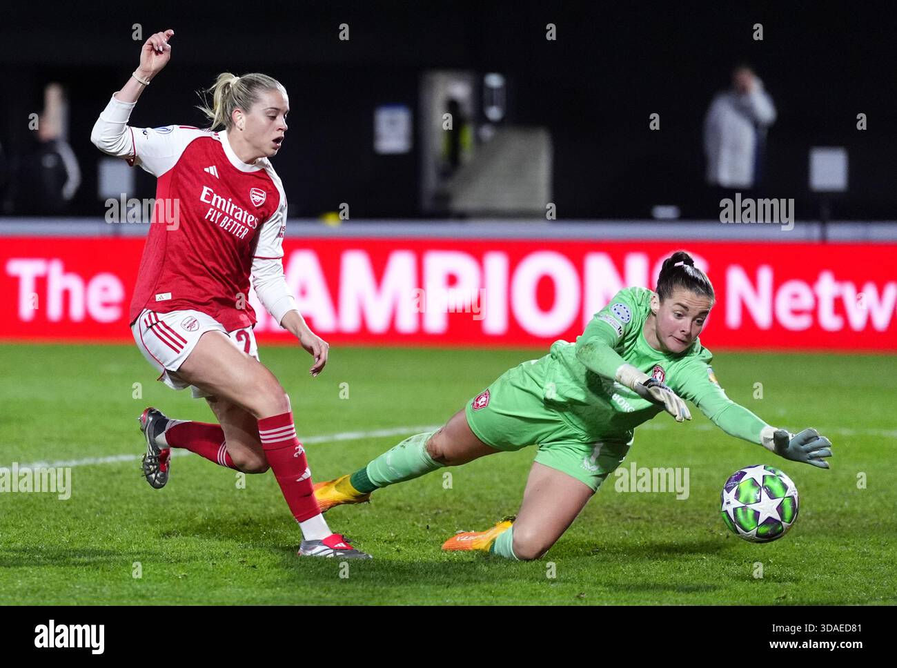 Arsenal's Alessia Russo and FC Twente goalkeeper Diede Lemey in action ...