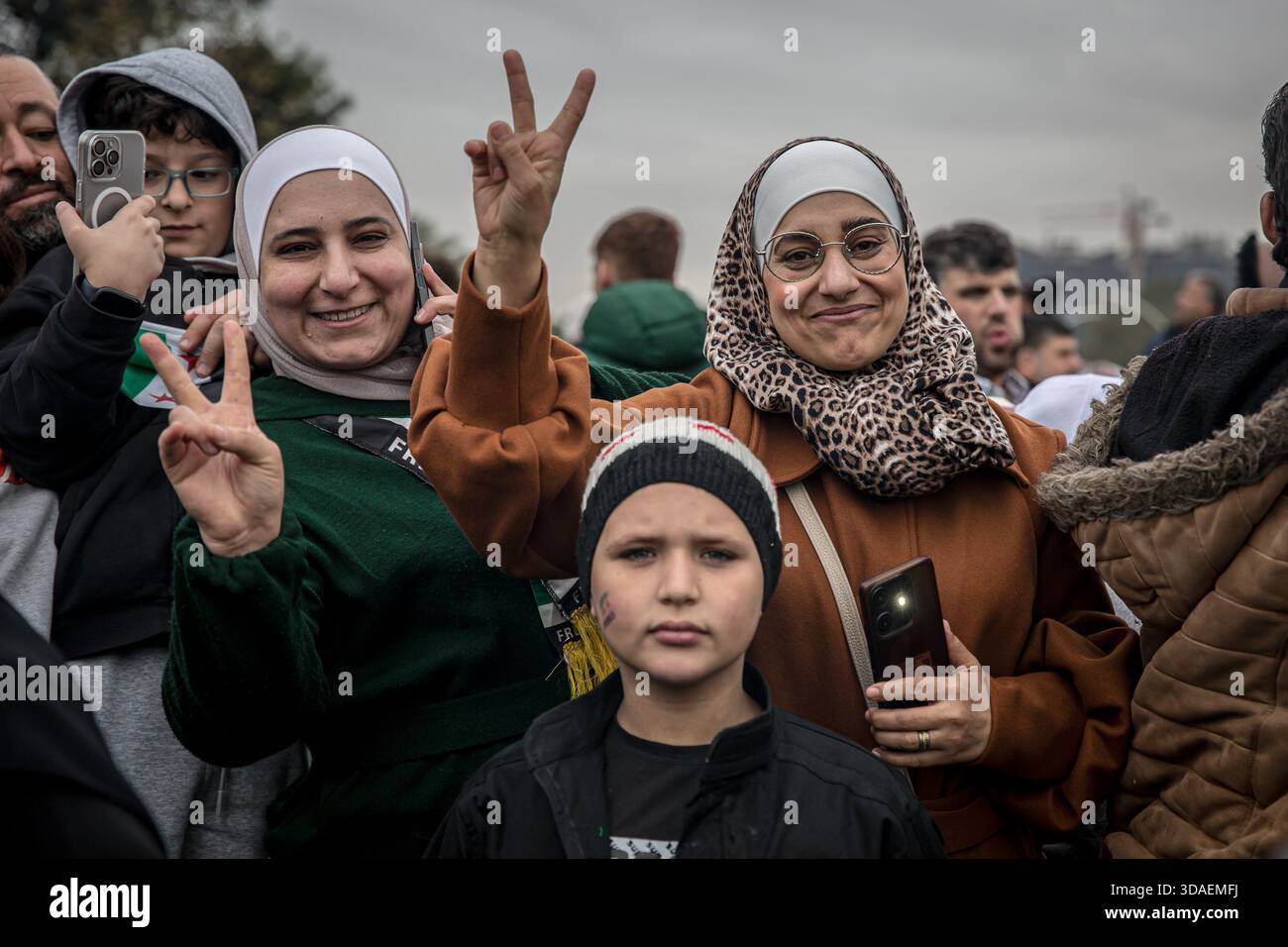 Crowds gather to watch a military parade in Damascus, held on the first ...