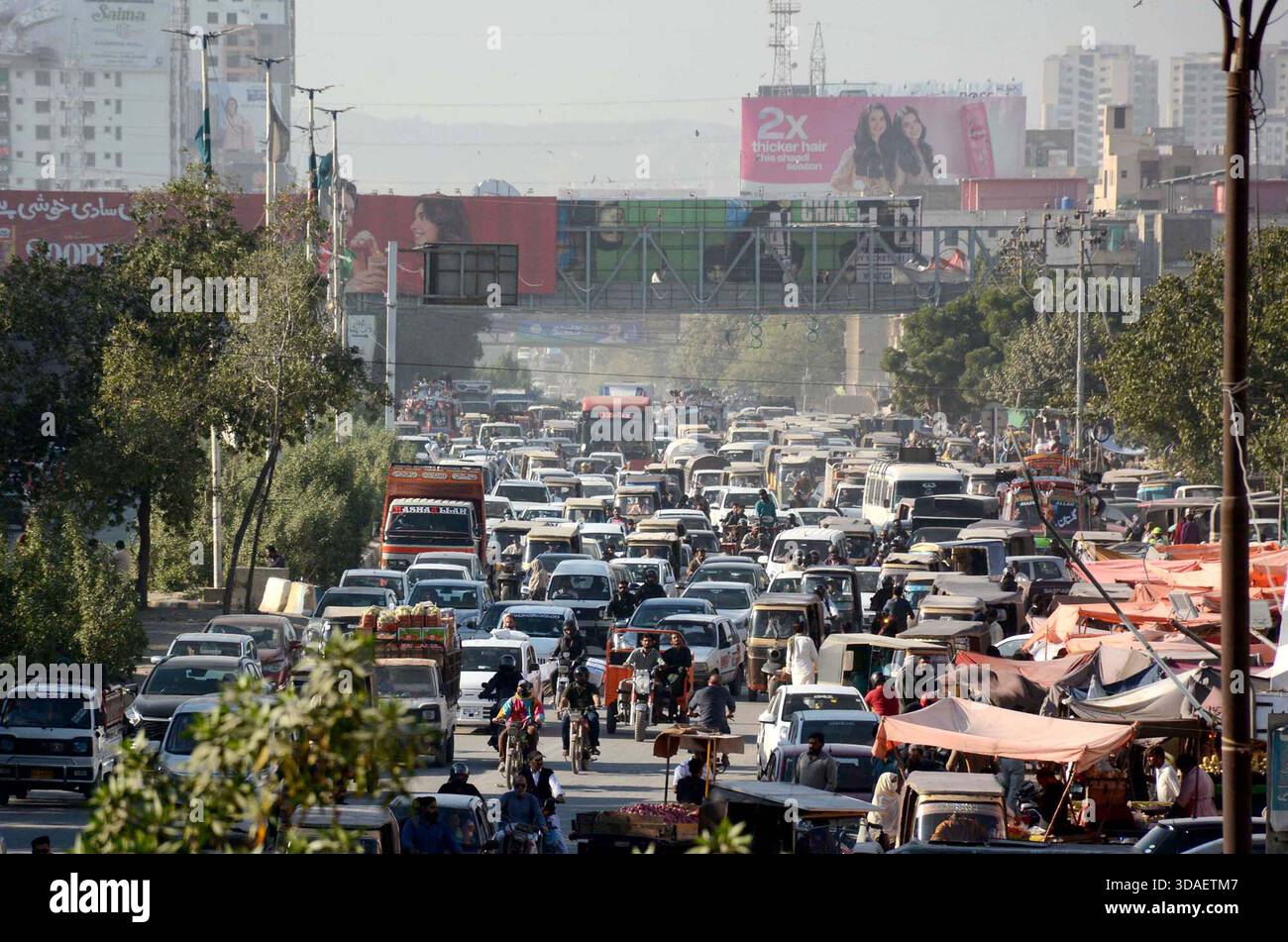 KARACHI, PAKISTAN, DEC 10: A large numbers of vehicles stuck in traffic ...