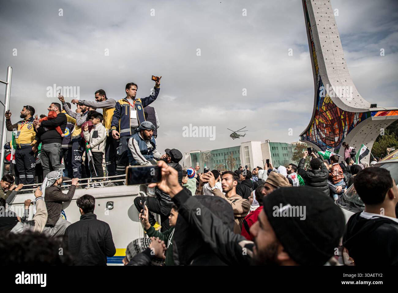 December 9, 2025, Damascus, Syria: A crowd watch helicopters perform ...