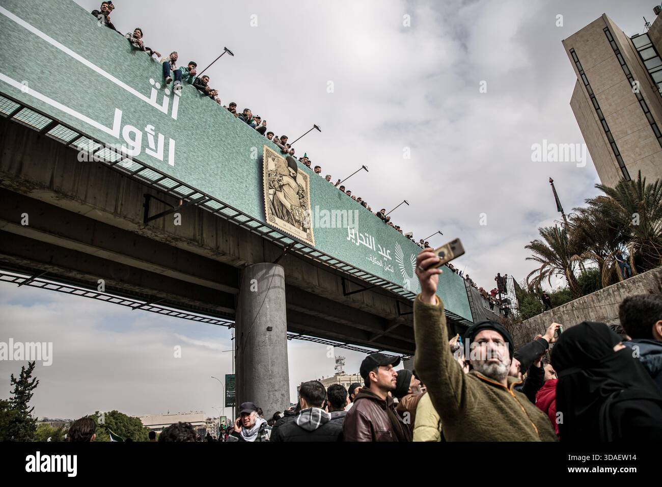 December 9, 2025, Damascus, Syria: A man takes a selfie as a crowd ...