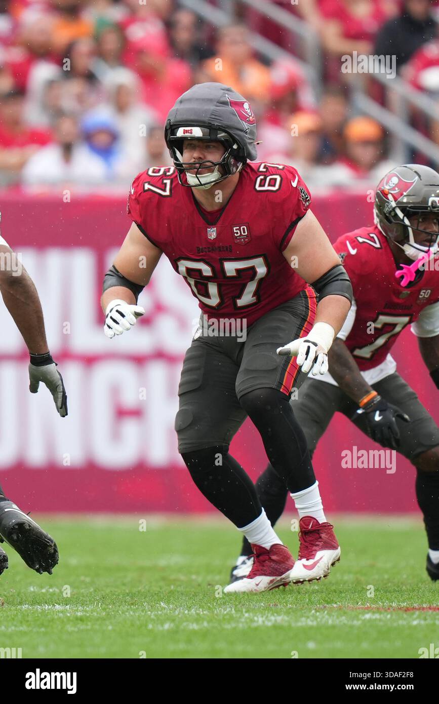 Tampa Bay Buccaneers offensive tackle Luke Goedeke (67) run blocks ...