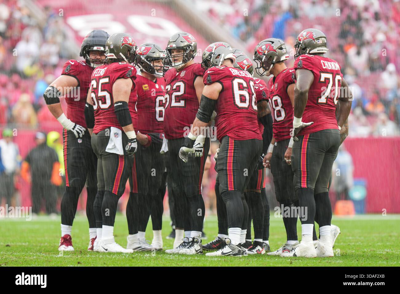 The Tampa Bay Buccaneers offiense huddles for a play during an NFL ...