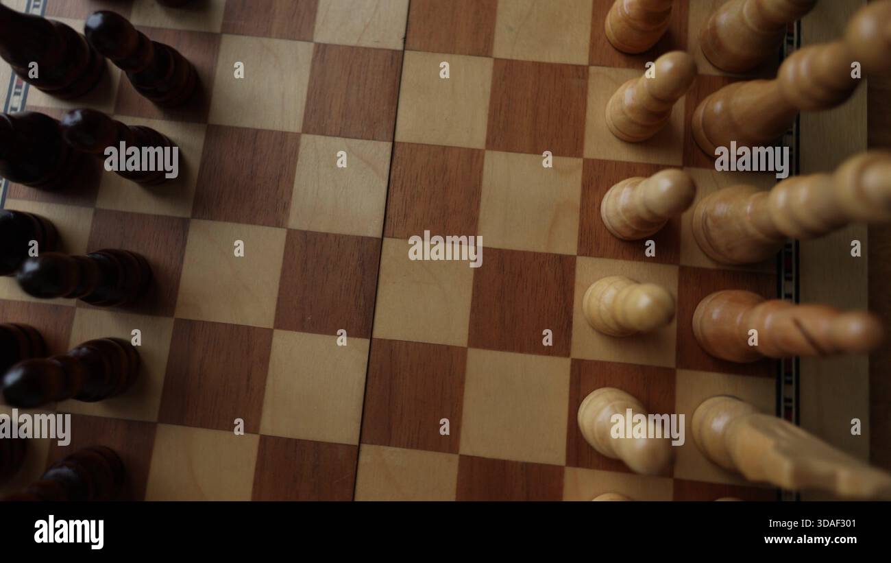 Moving footage of chess pieces on a spinning game board, illustrating ...