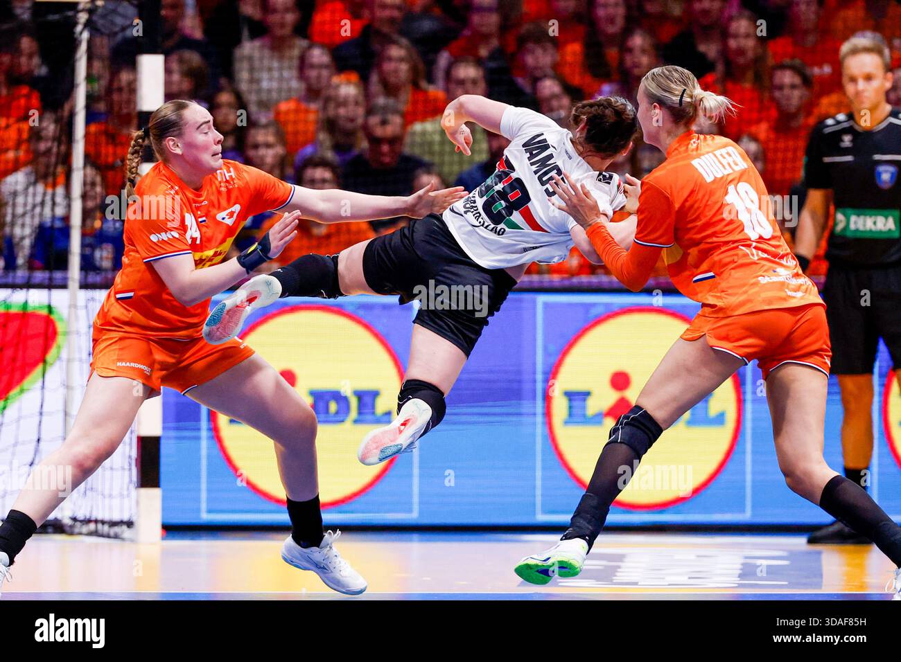 Petra Vamos of Hungary throw the ball under the pressure Kelly Dulfer ...