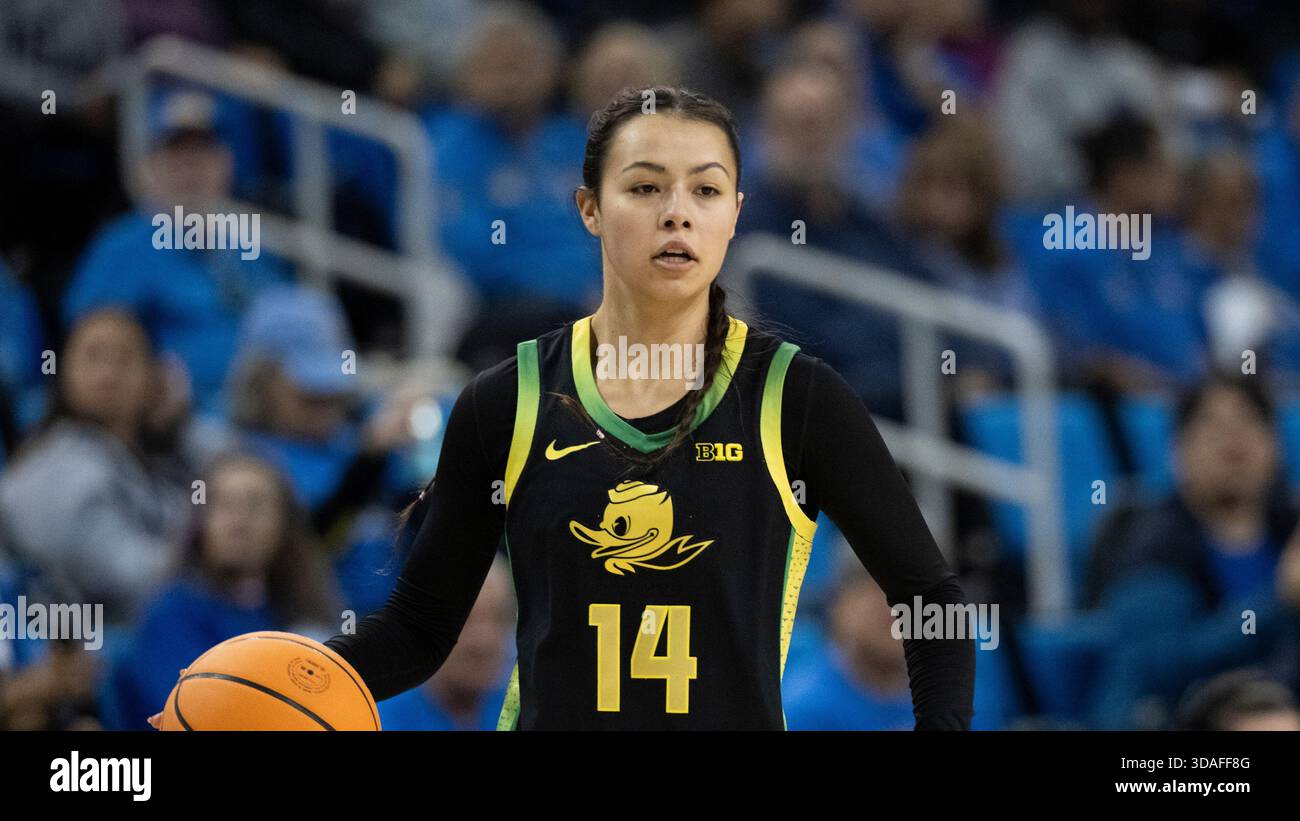 Oregon guard Ari Long (14) dribbles during an NCAA basketball game ...