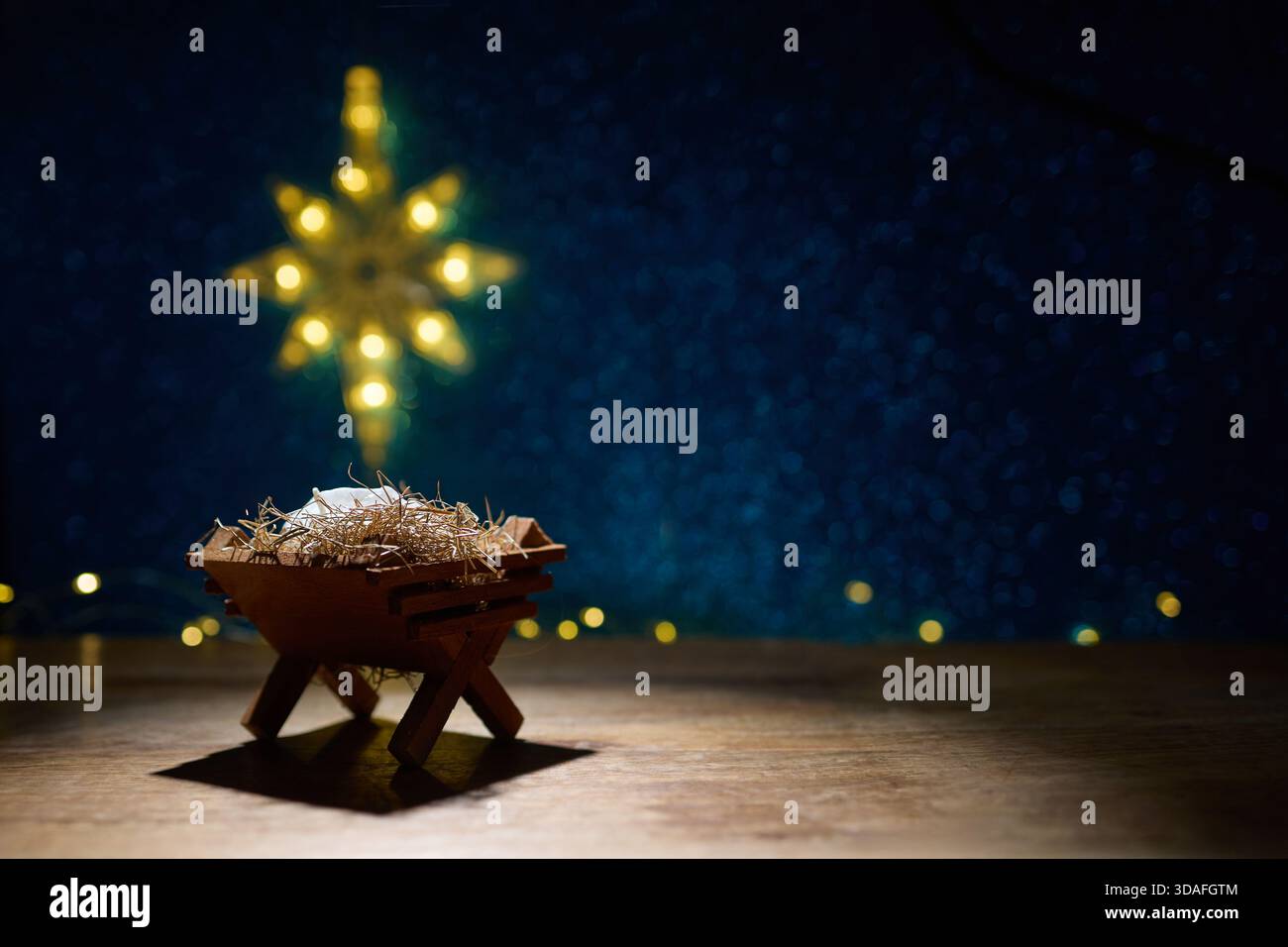 Jesus born. Nativity Scene. A wooden manger with straw under a star ...