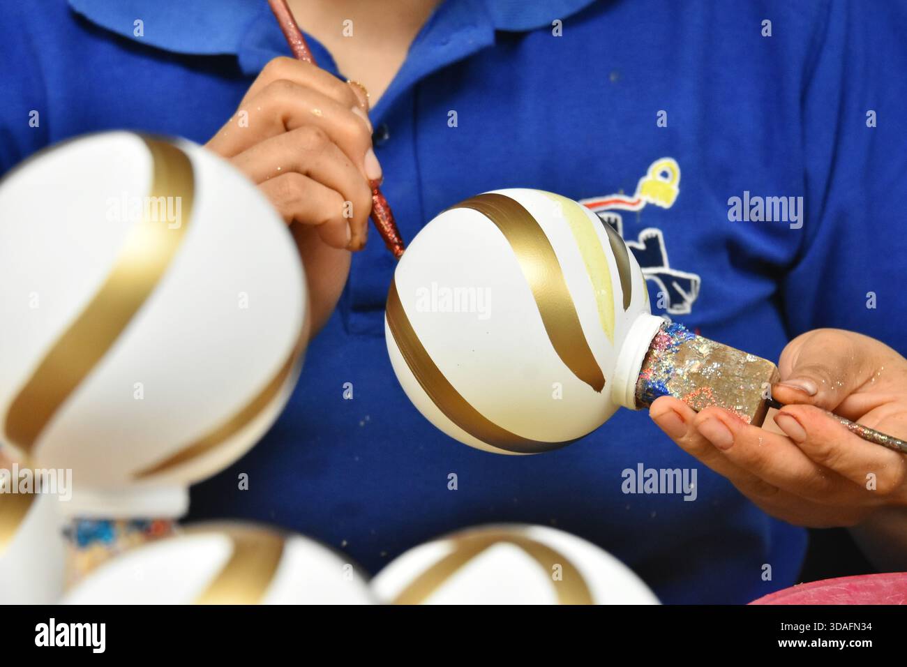 A worker at the Christmas ornament factory 'El Castillo de la Esfera ...