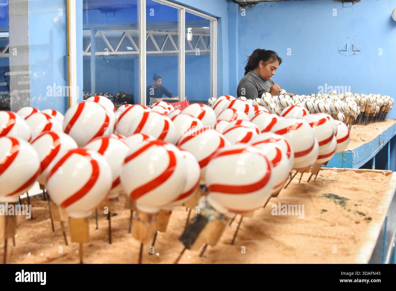 A worker at the Christmas ornament factory 'El Castillo de la Esfera ...