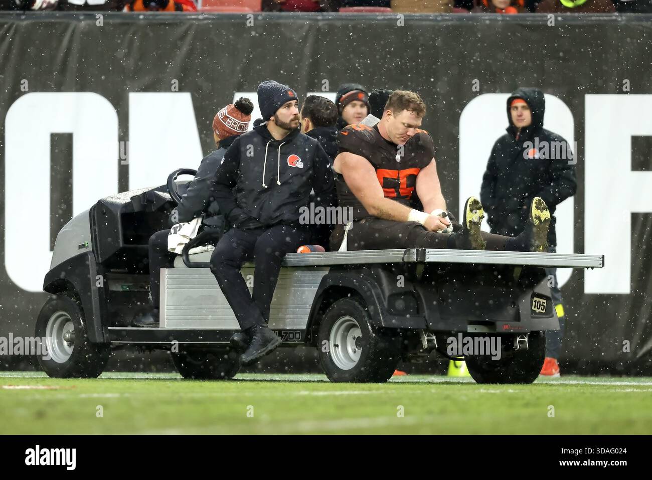 Cleveland Browns center Ethan Pocic (55) is carted off of the field ...