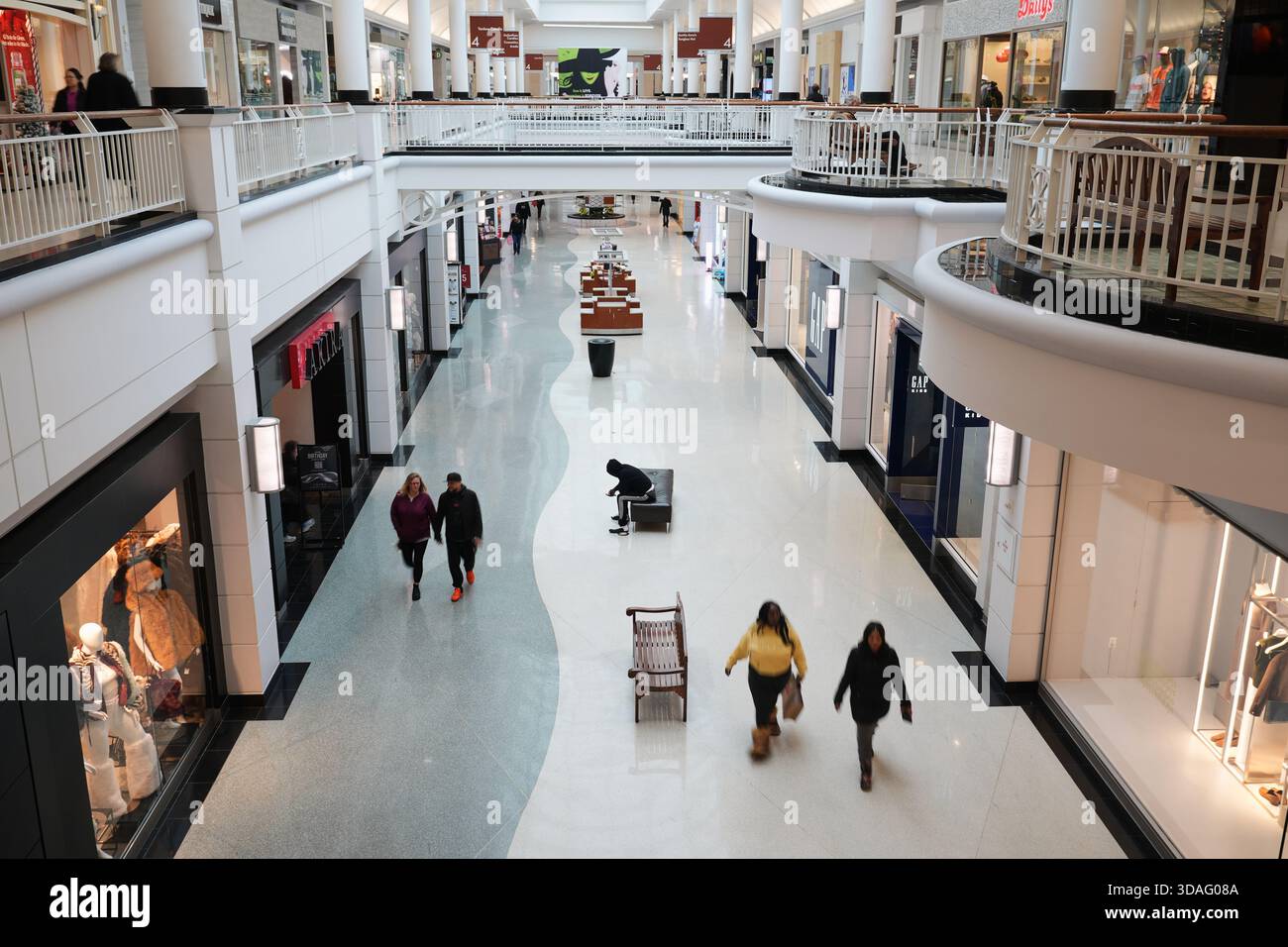People walk through a shopping mall in Towson, Md., Wednesday, Dec. 10 ...