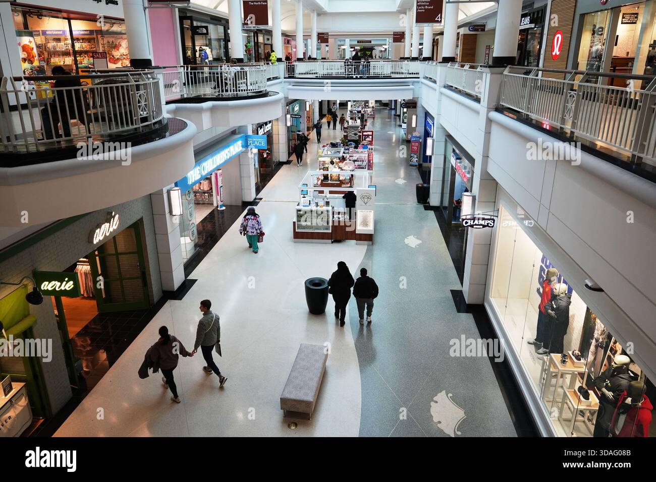 People walk through a shopping mall in Towson, Md., Wednesday, Dec. 10 ...