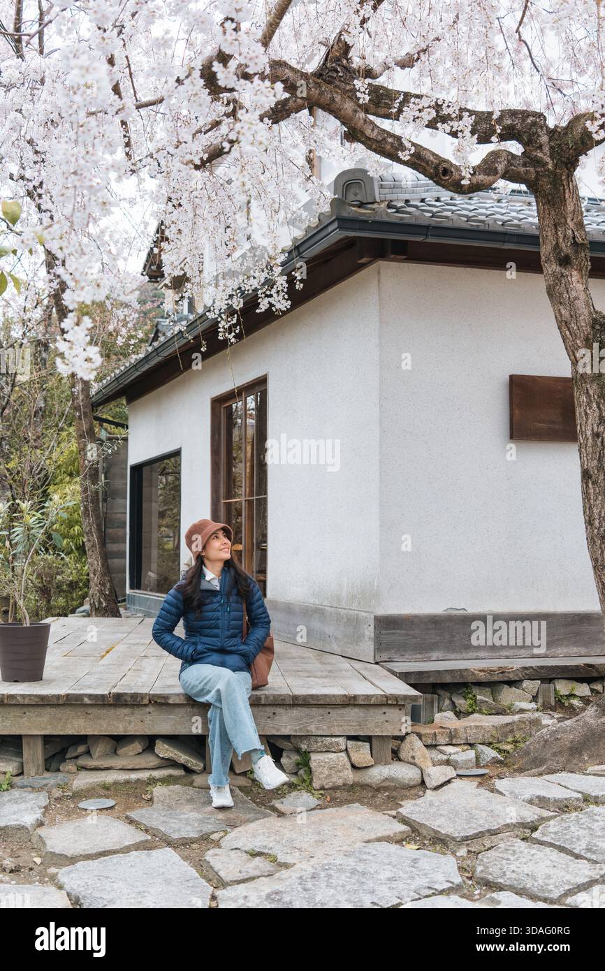 Female tourist sitting under hi-res stock photography and images - Alamy
