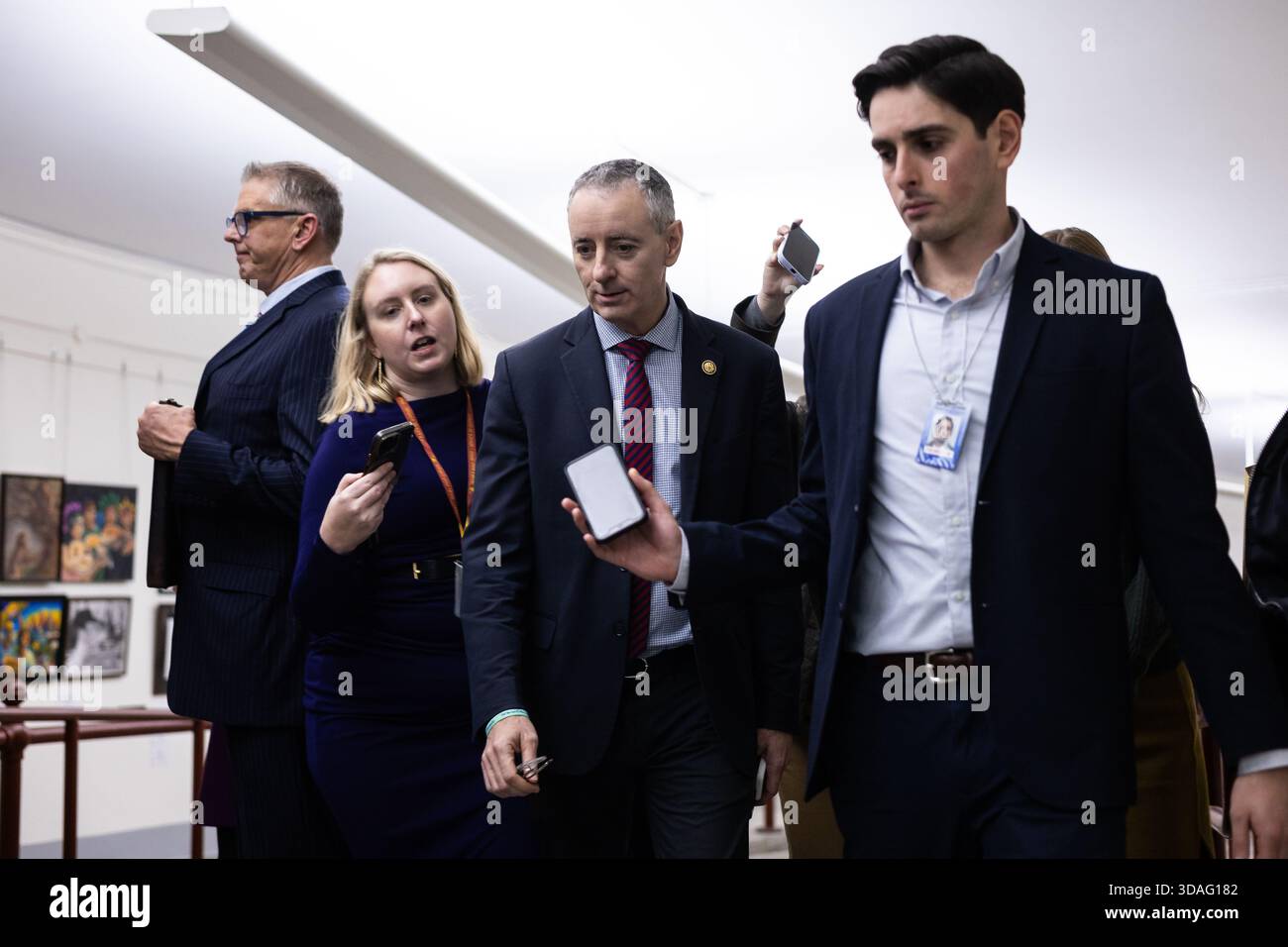 Rep. Brian Fitzpatrick (R-Pa.) speaks with reporters as he walks to a ...