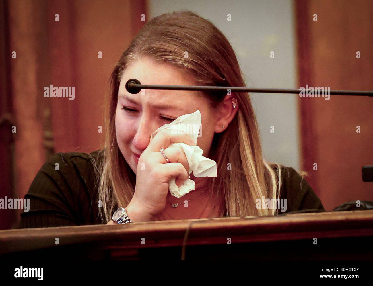 Alissa Kirby, a friend of murder victim Ana Walsh, wipes away tears as ...