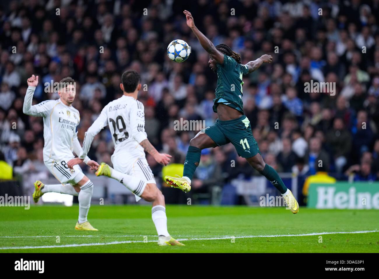 Manchester City's Jeremy Doku, right, fights for the ball with Real ...