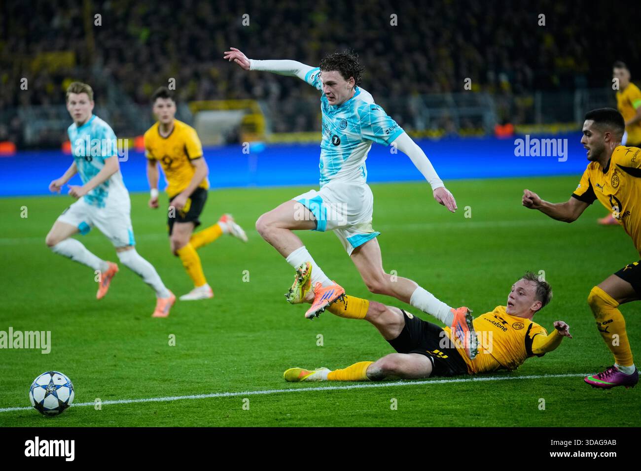 Glimt's Isak Dybvik Maatta is tackled by Dortmund's Maximilian Beier ...