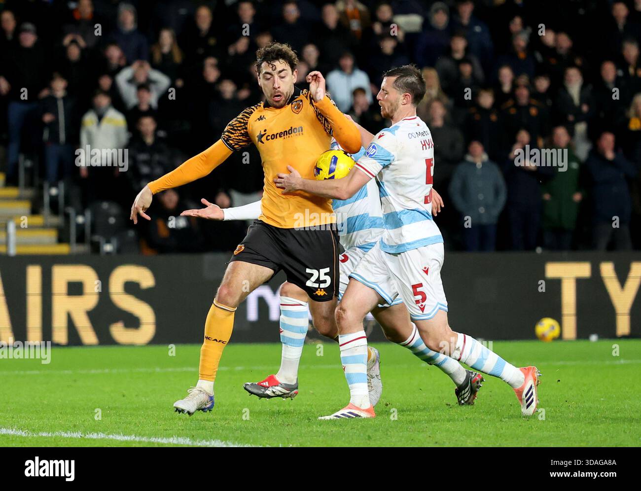 Hull City's Matt Crooks (left) and Wrexham's Dominic Hyam battle for ...
